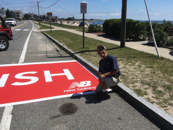 Painting the Falmouth Road Race Finish Line 2019 – Locust Street Sign
